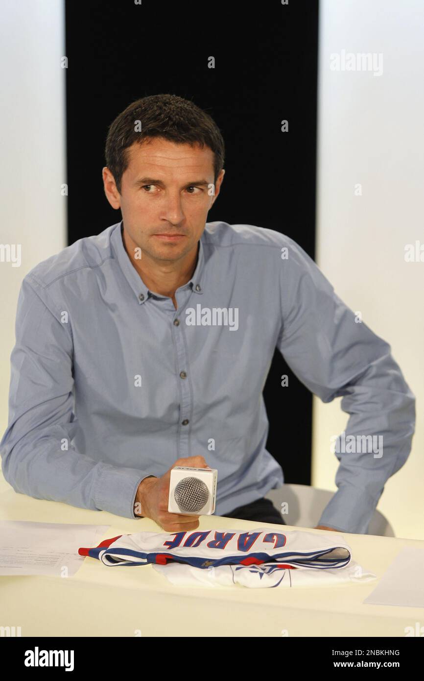 Lyon's new coach Remi Garde looks on during a press conference to ...