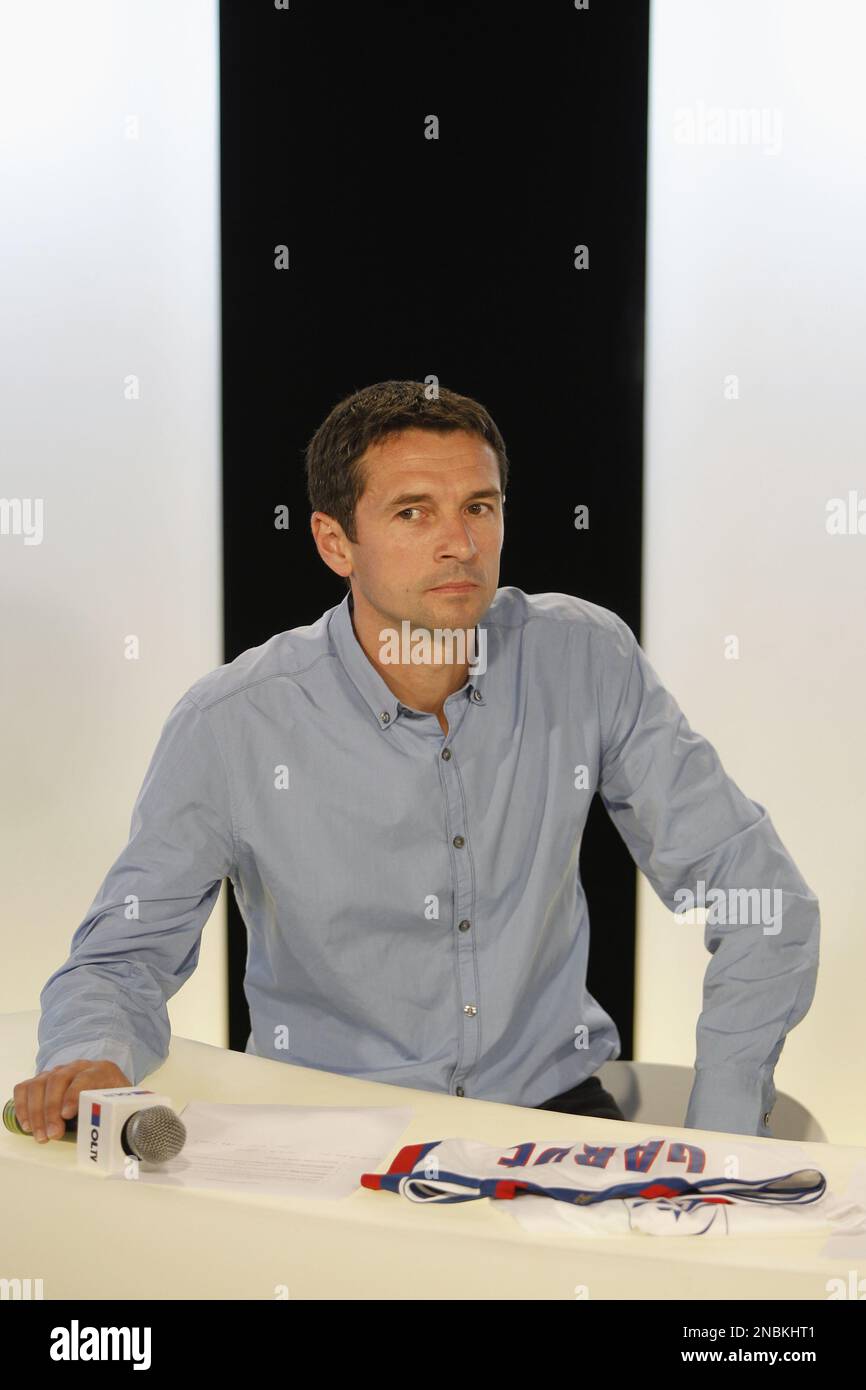 Lyon's new coach Remi Garde looks on during a press conference to ...