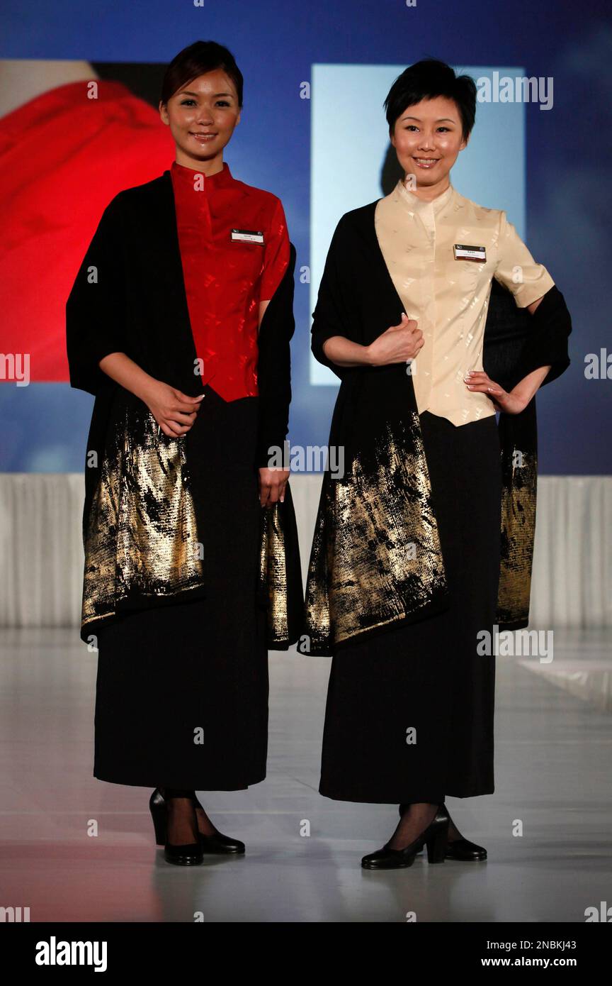 Cathay Pacific staff members present the new uniform at a news ...