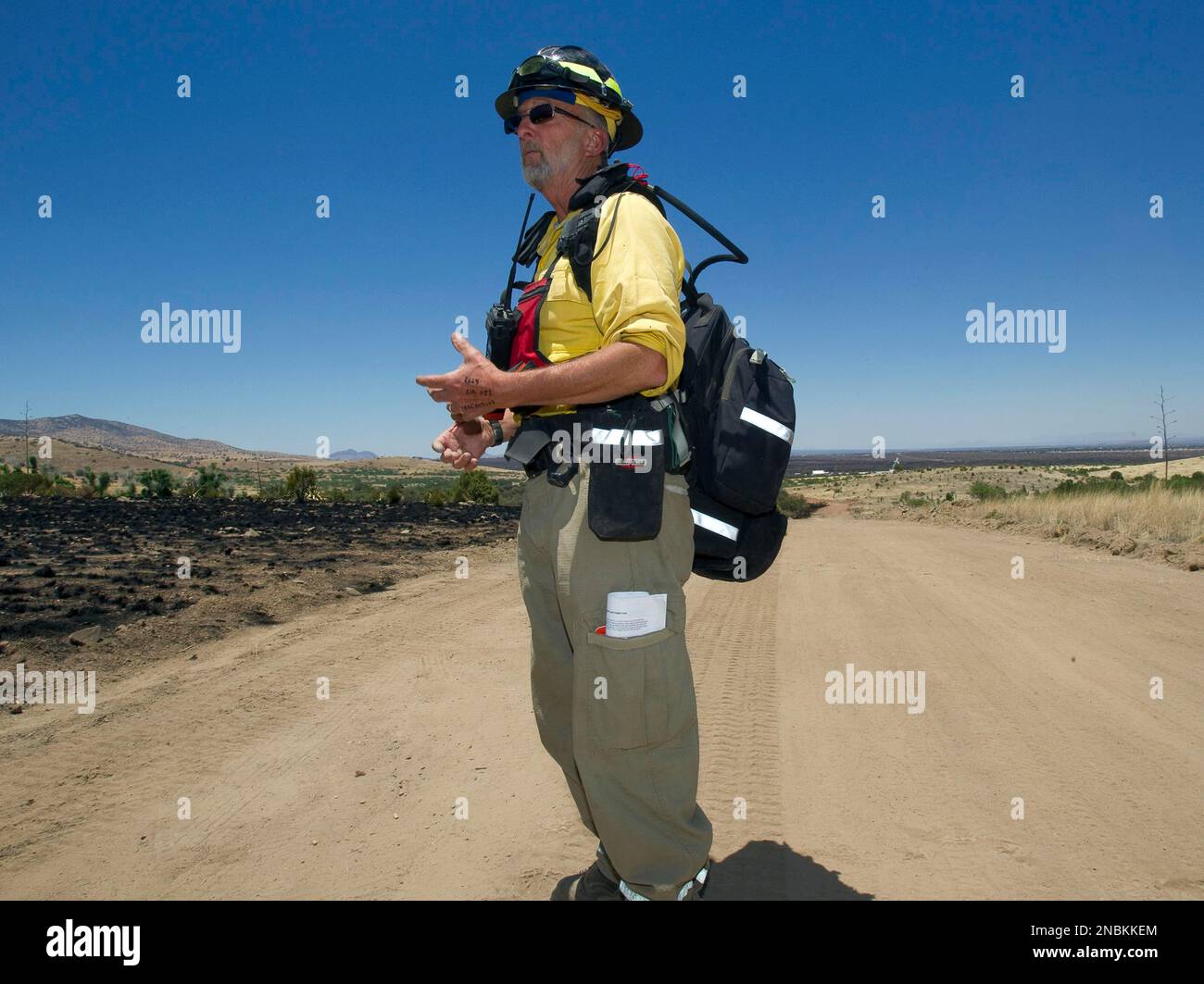 Operations Director Steve Creech stands in a road used as a fire break ...