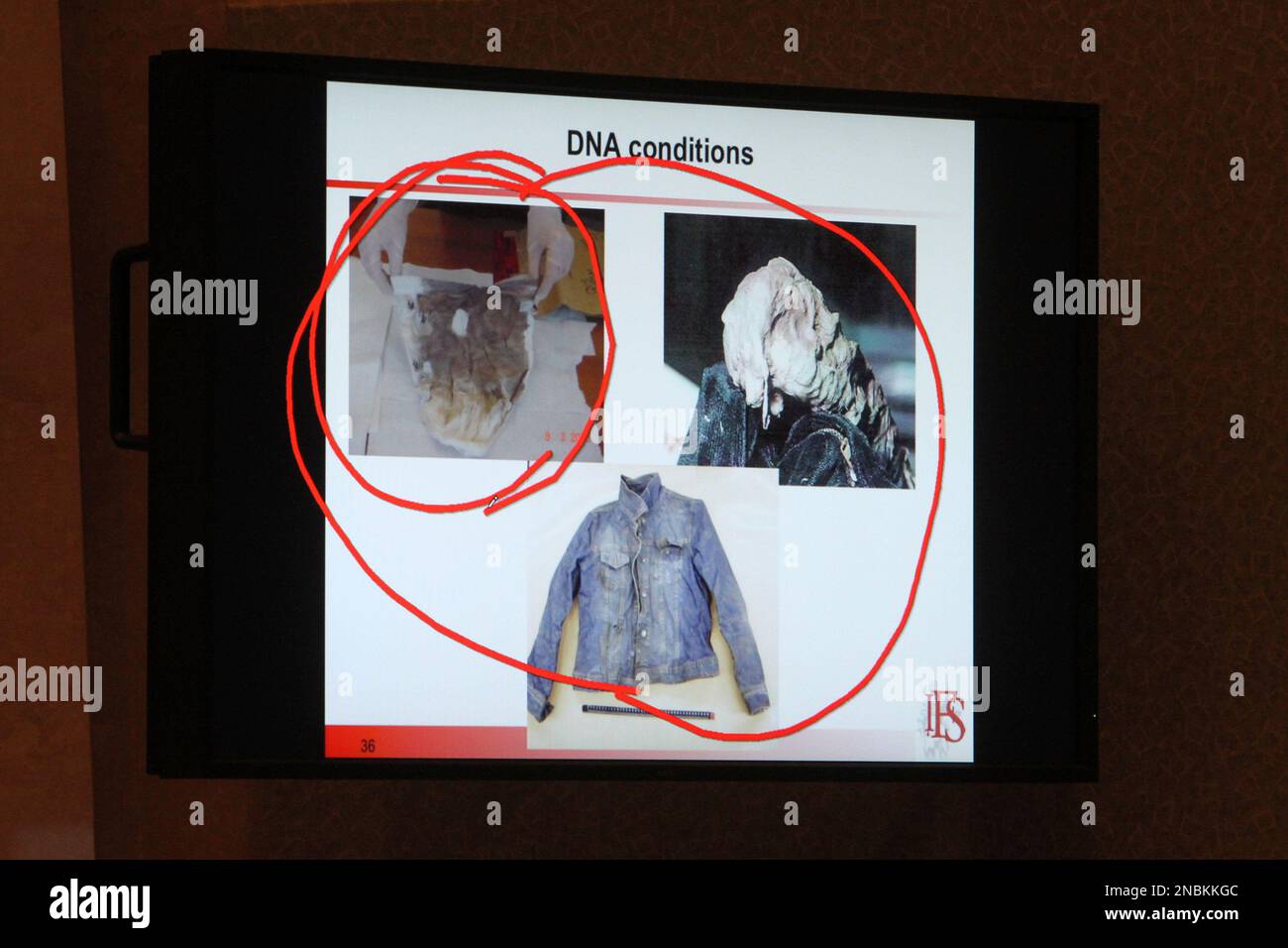 This image seen on a courtroom monitor shows a slide from a ...
