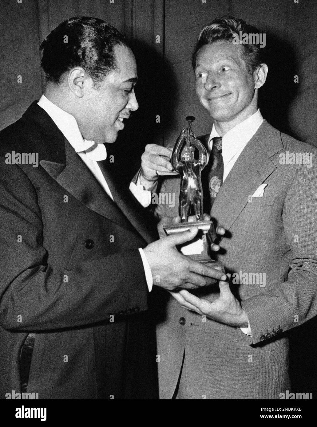 Bandleader-composer Duke Ellington receives an “Oscar” from Danny Kaye ...