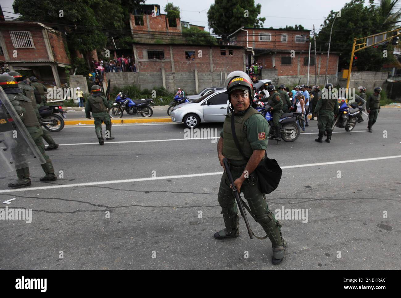 A National Guard soldier stands on guard at a checkpoint outside of the ...