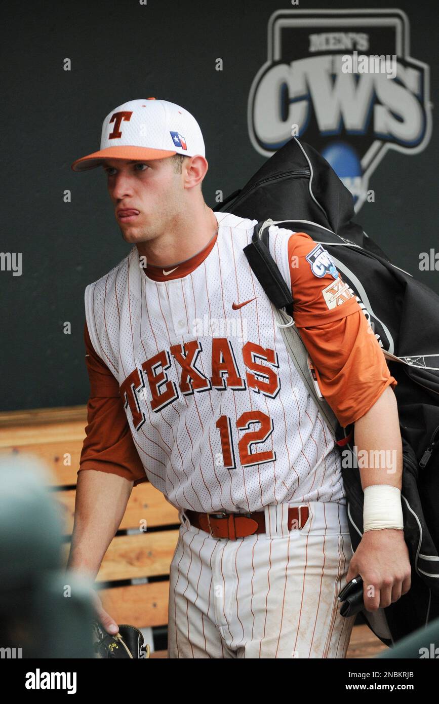 Texas catcher Jacob Felts leaves the dugout with his gear after Texas ...
