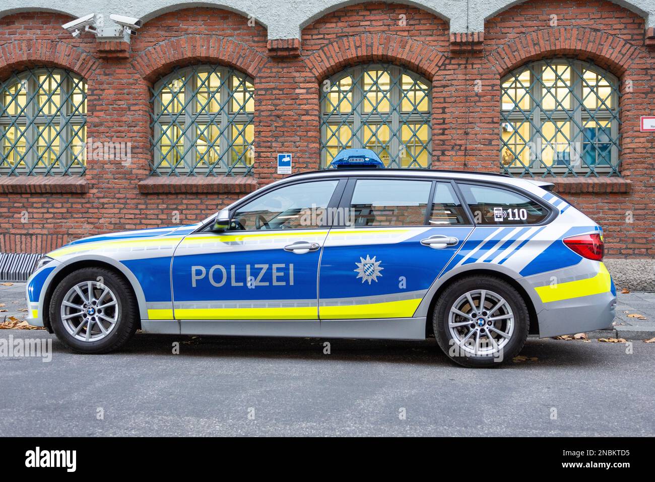 A German police car is parked at the side of the street in Munich ...