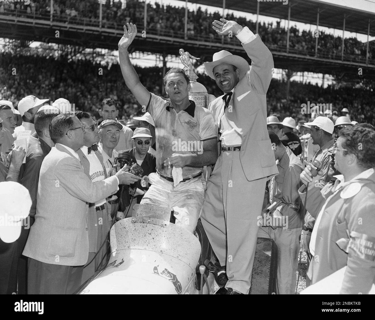 Troy Ruttman (left), Lynwood, Calif., who drove the wining car in the ...