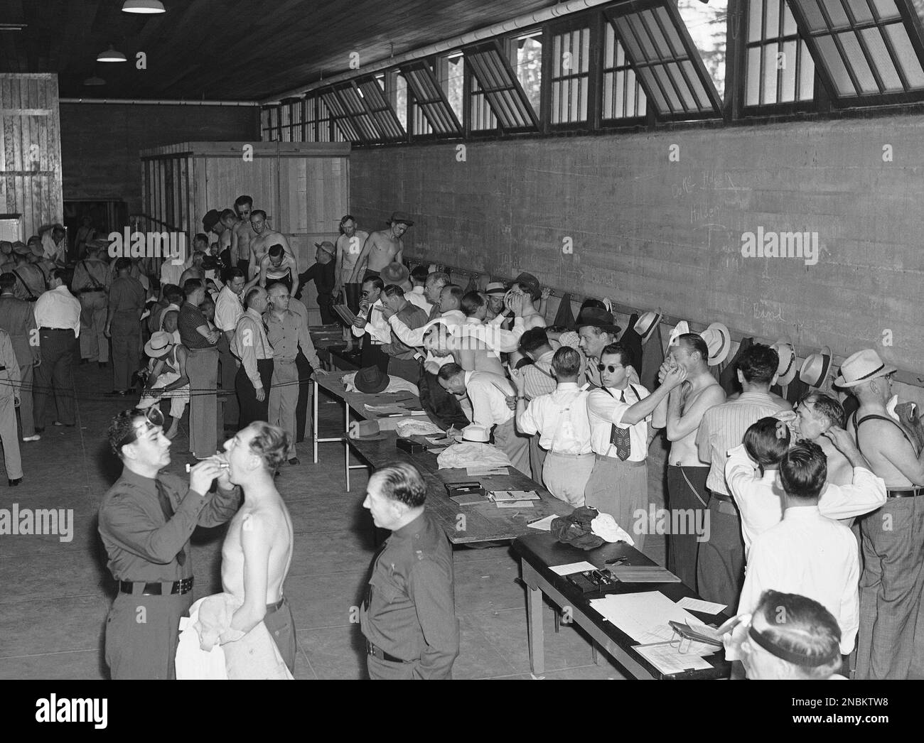 Applicants are shown undergoing physical examinations in Los Angeles on ...