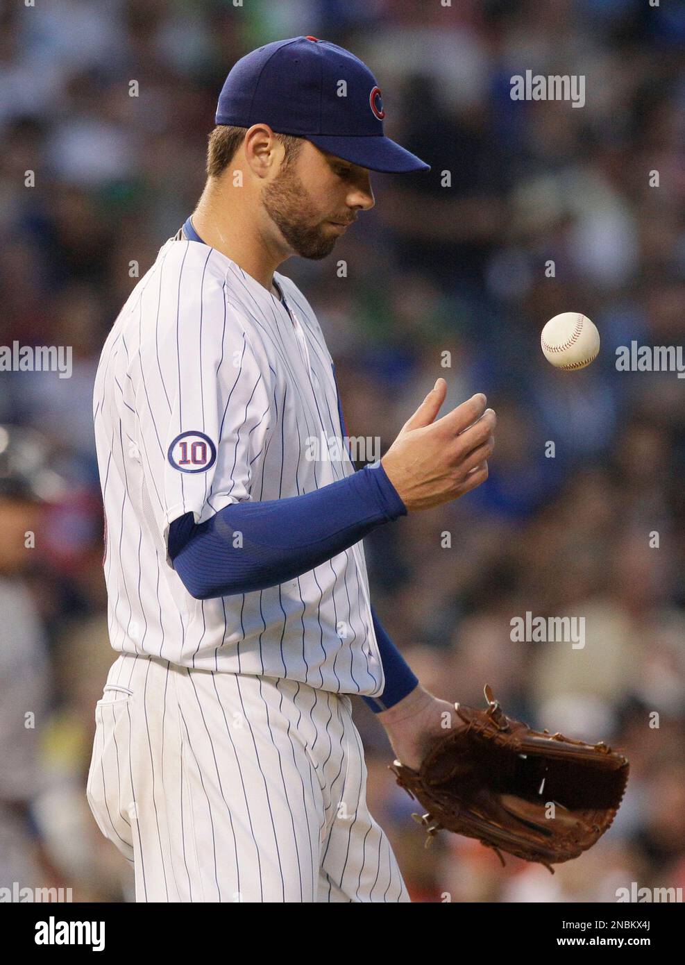 Chicago Cubs starter Randy Wells reacts as he tosses the ball after New ...