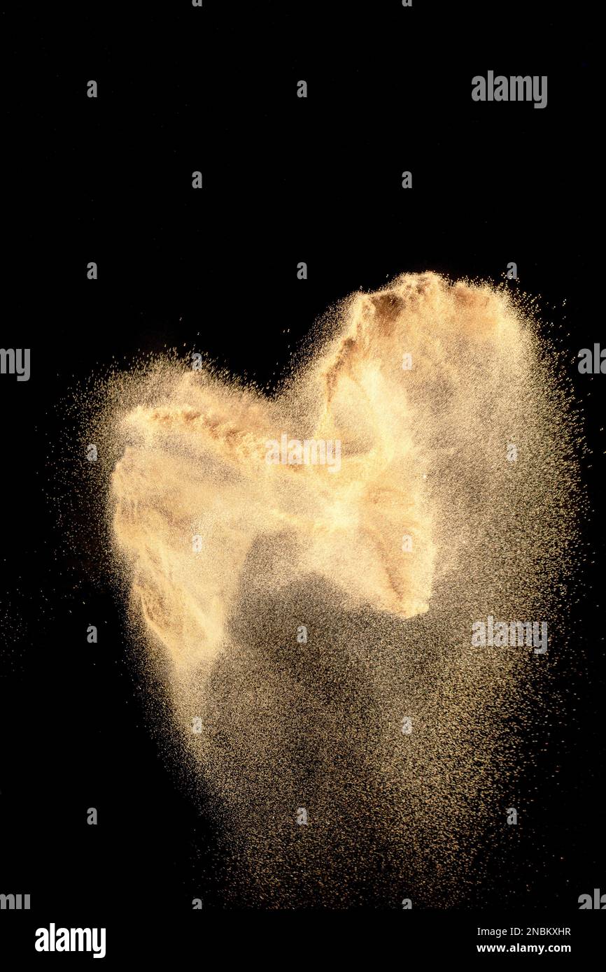 Brown dry river sand explosion isolated on white background. Abstract ...