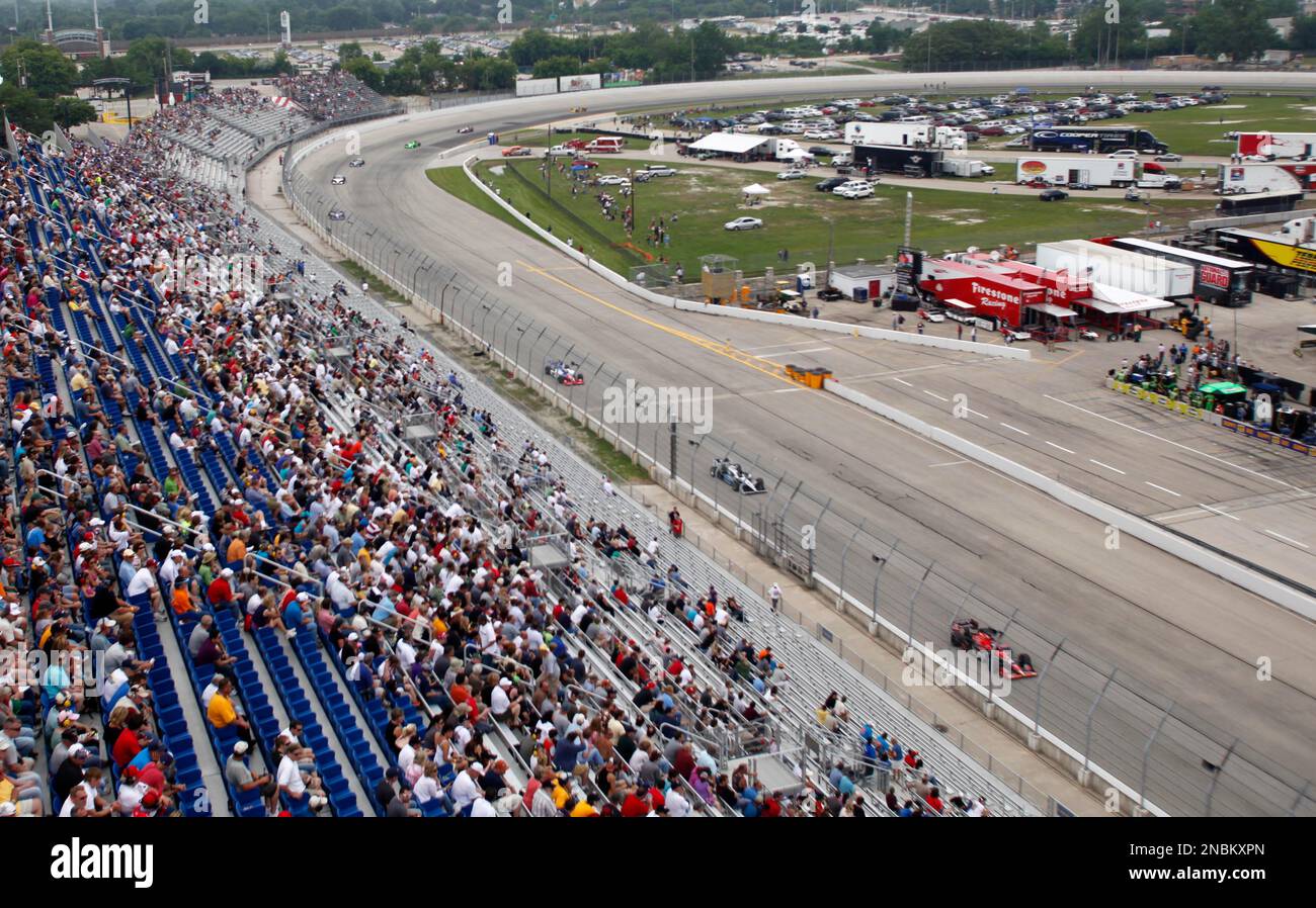 Cars race down the straight away at the IndyCar Series' Milwaukee Mile ...