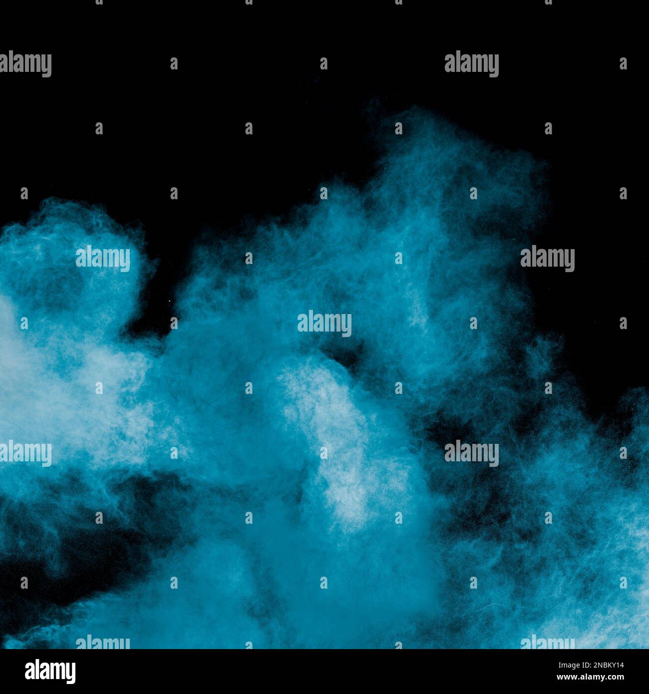 Blue dust explosion on black background. Freeze motion of color powder ...