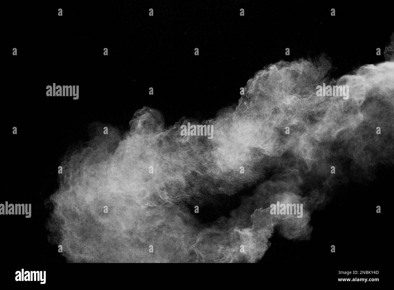 White talcume powder explosion on black background. White dust ...