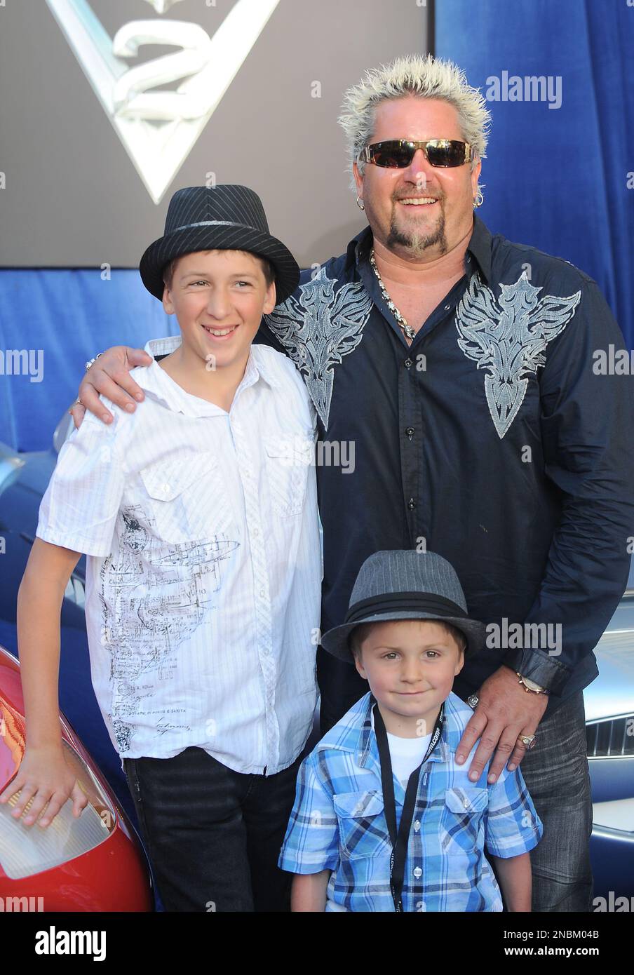 Guy Fieri, at left, and his sons, Hunter, at left, and Ryder arrives at ...