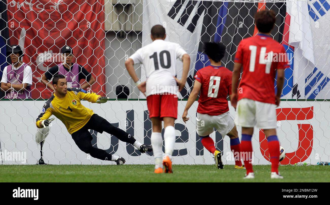 South Korea's Yoon Bit-garam (8) scores a penalty kick against Jordan's ...
