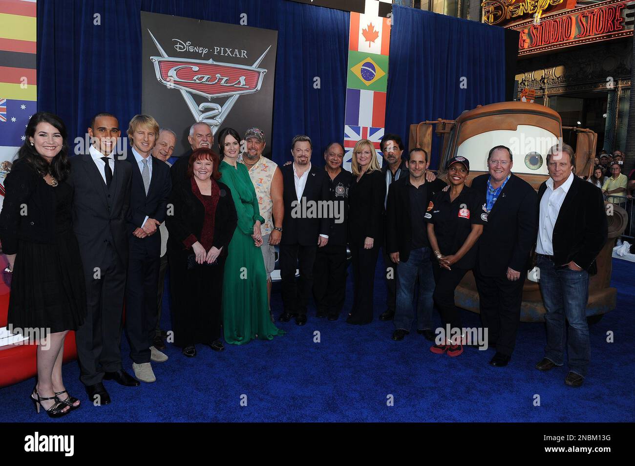 Members of the cast pose for a photo at the world premiere of "Cars 2 ...