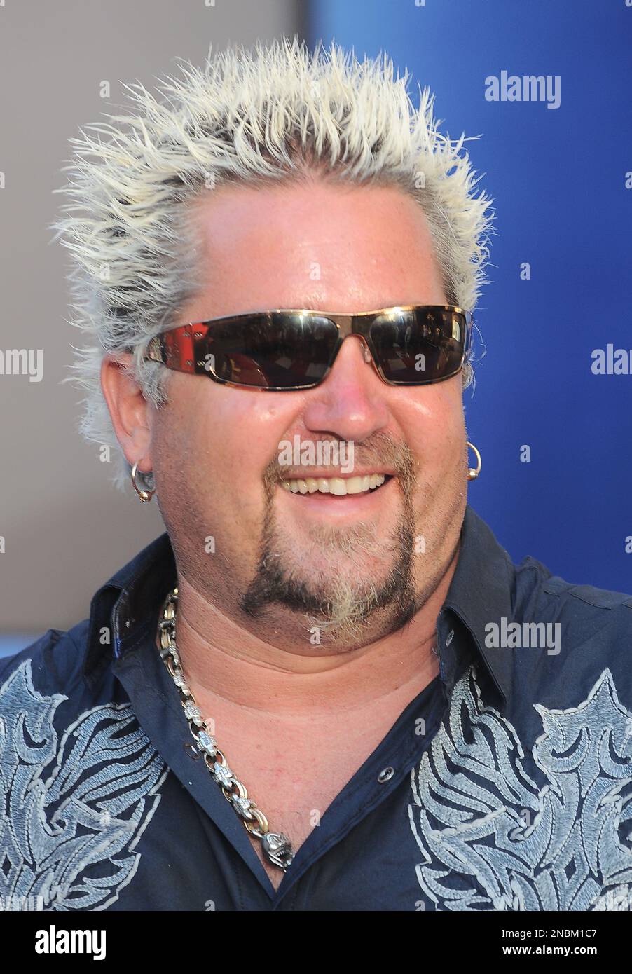 Guy Fieri arrives at the world premiere of "Cars 2" at El Capitan ...