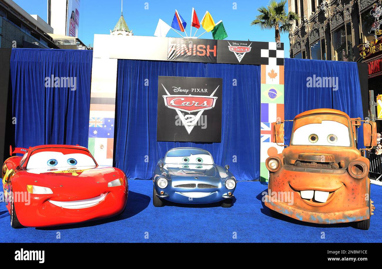 Cars inspired by the movie parade down the red carpet at the world ...