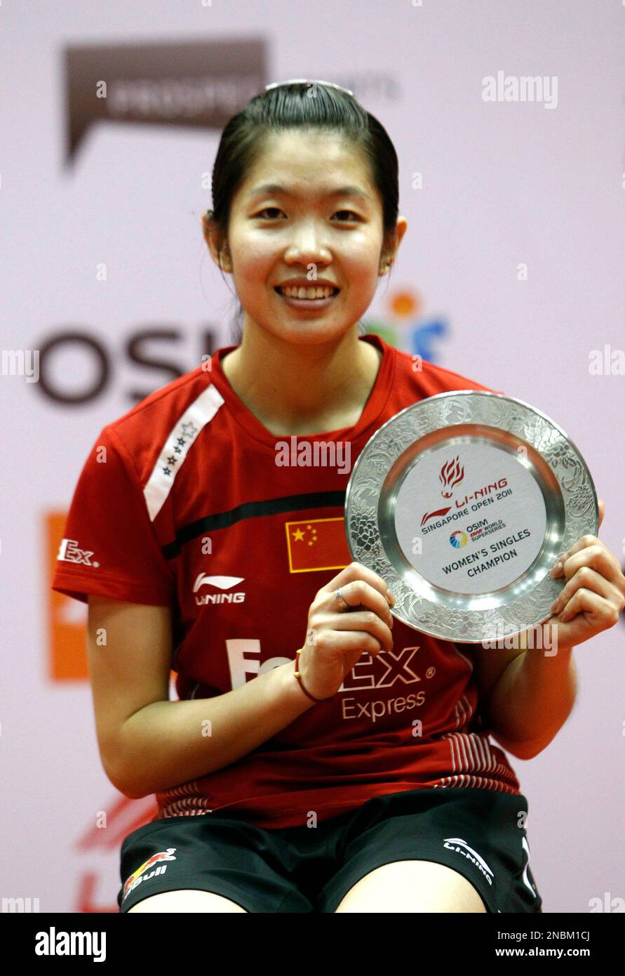 Wang Xin of China smile with her trophy after beating Tine Baun of ...