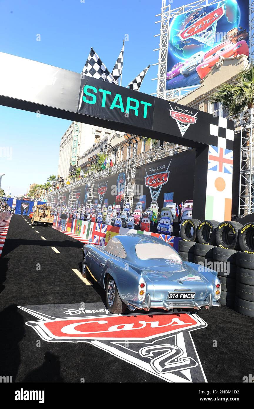 Cars inspired by the movie parade down the red carpet at the world ...