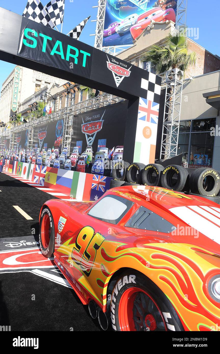 Cars inspired by the movie parade down the red carpet at the world ...