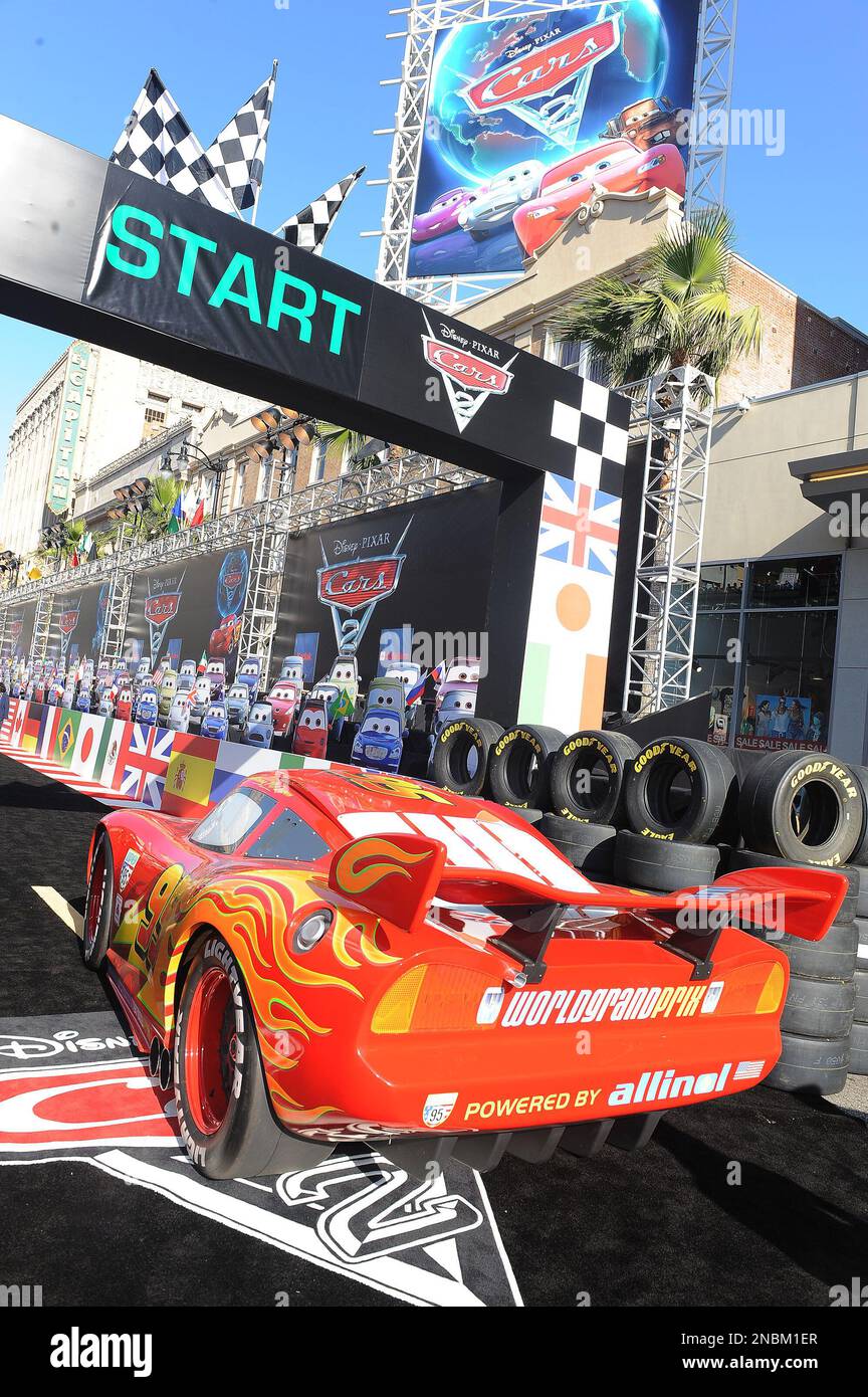 Cars inspired by the movie parade down the red carpet at the world ...