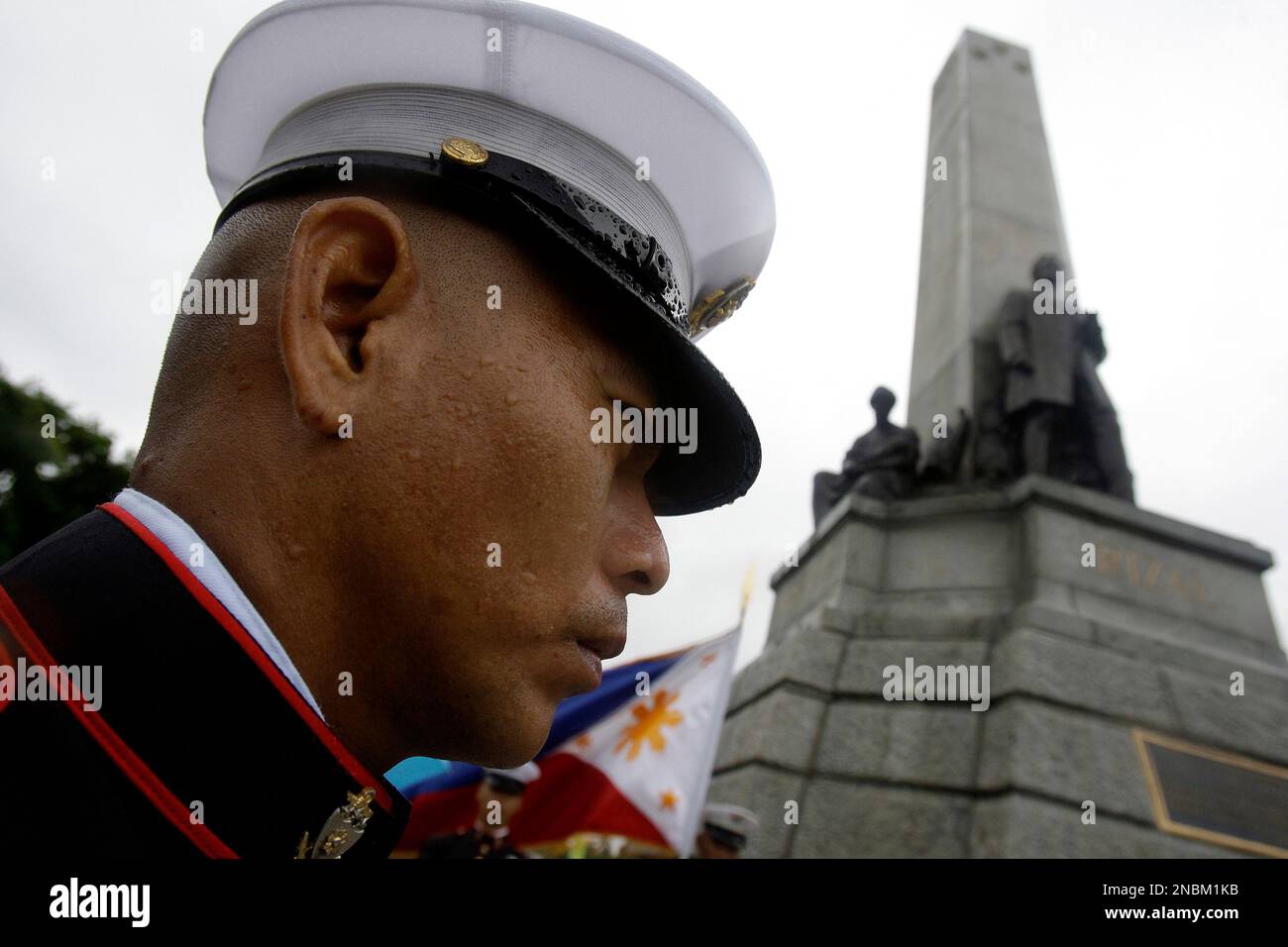 A Filipino soldier stands beside the monument of Jose Rizal during ...