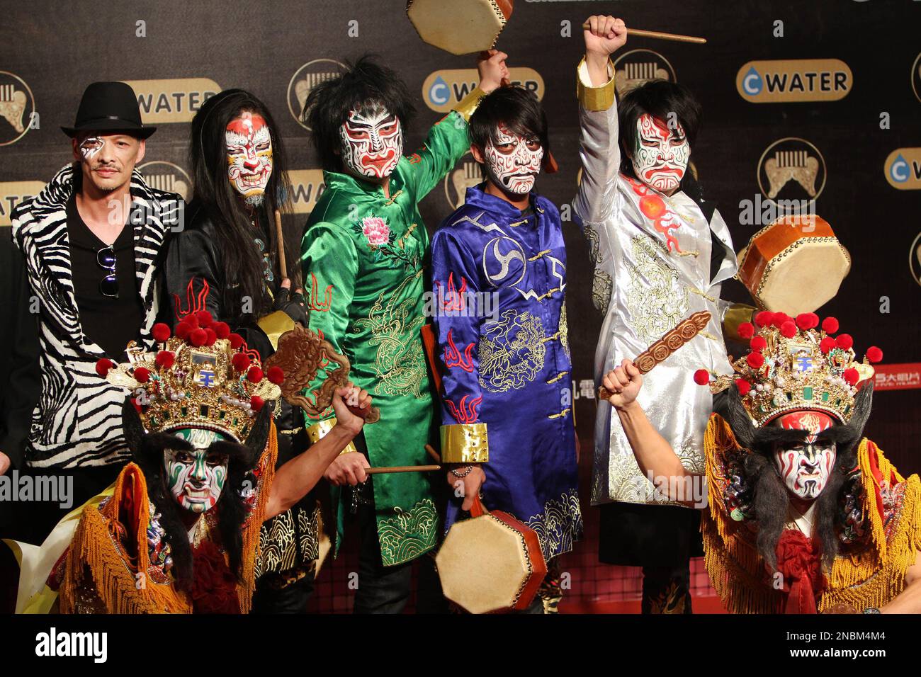 Taiwanese pop group Chairman Band poses for photos as they arrive for ...