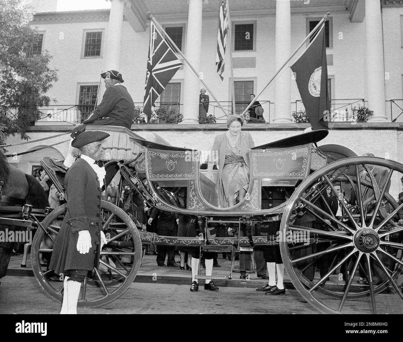 Queen Mother Elizabeth boards a horse-drawn carriage in front of the ...