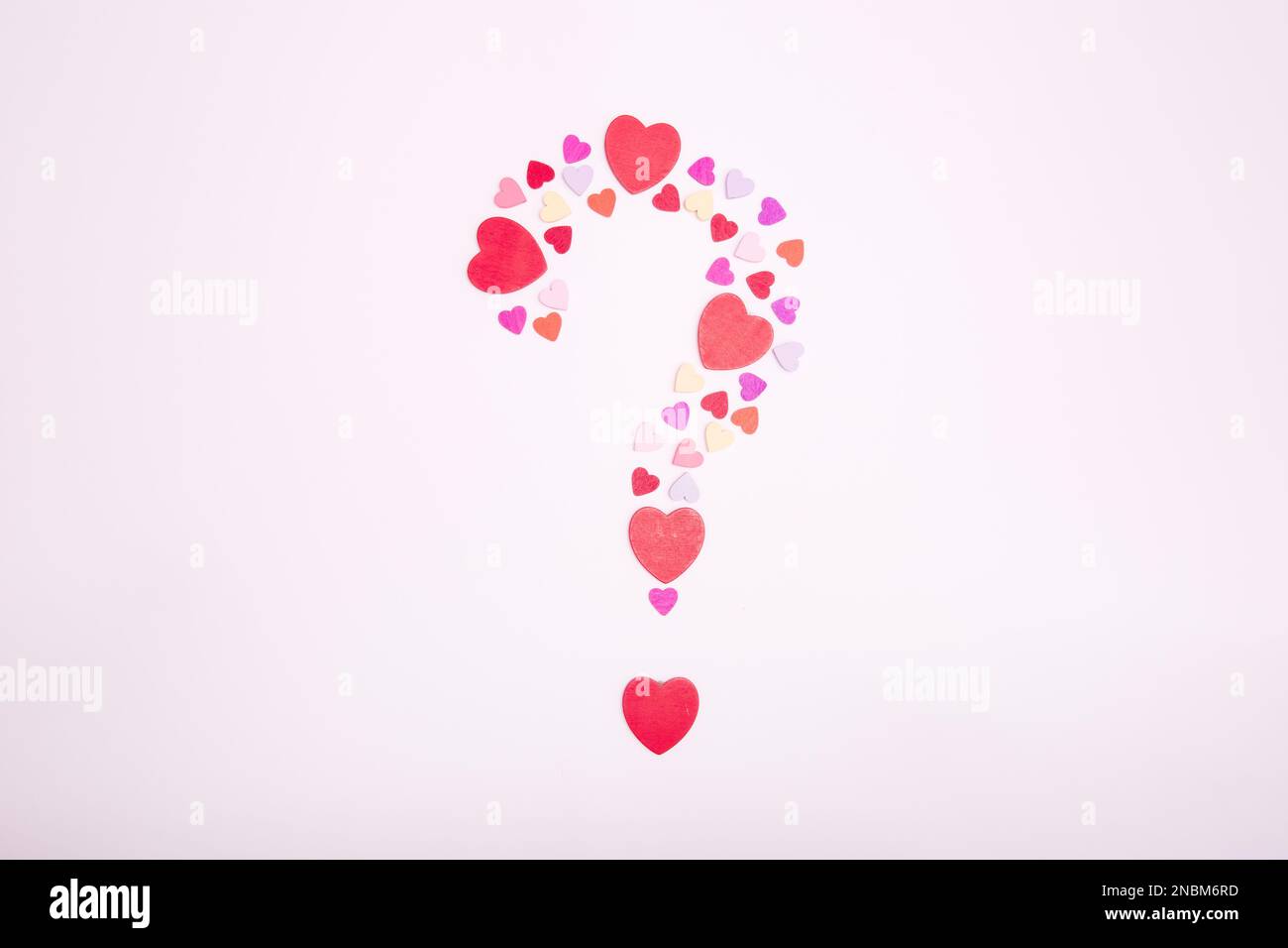 Question symbol made from hearts on a gray background. Marriage ...