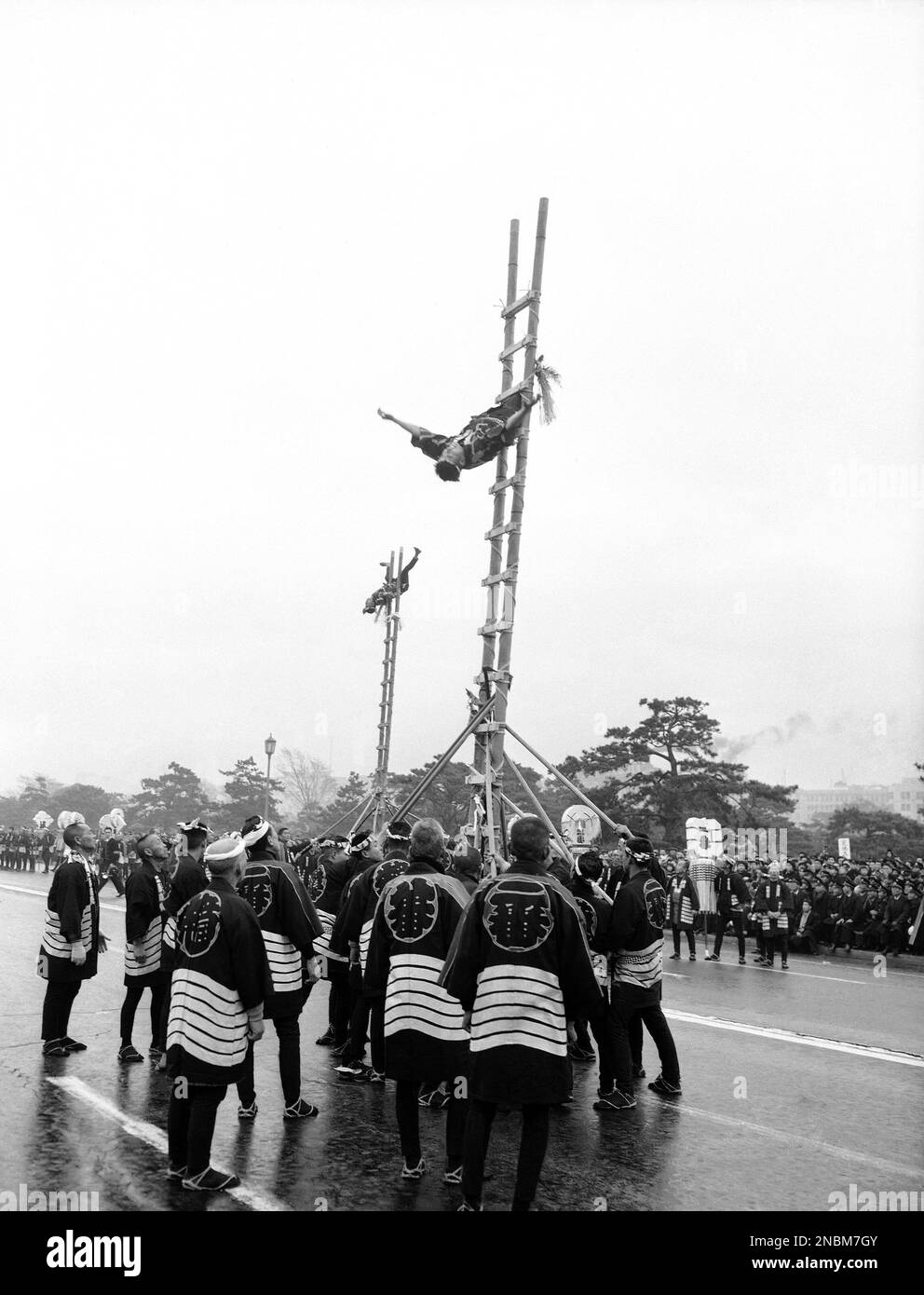 Japanese firemen, wearing the colorful “happi” coats of earlier days ...