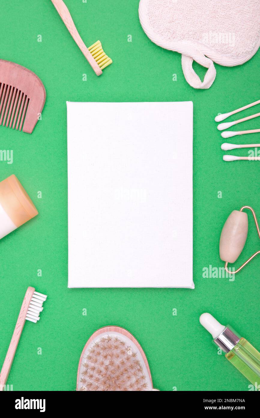 A frame of hygiene items and a white empty rectangle on a green ...