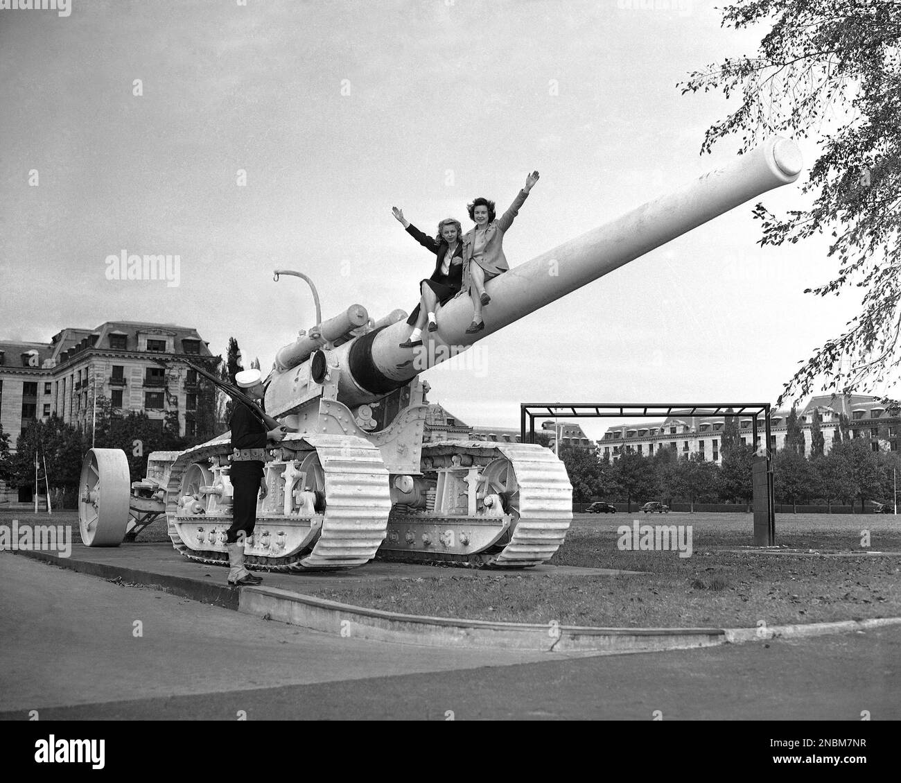 Anne Bennett, left, and Nancy Sabalot sit on the barrel of an eight ...