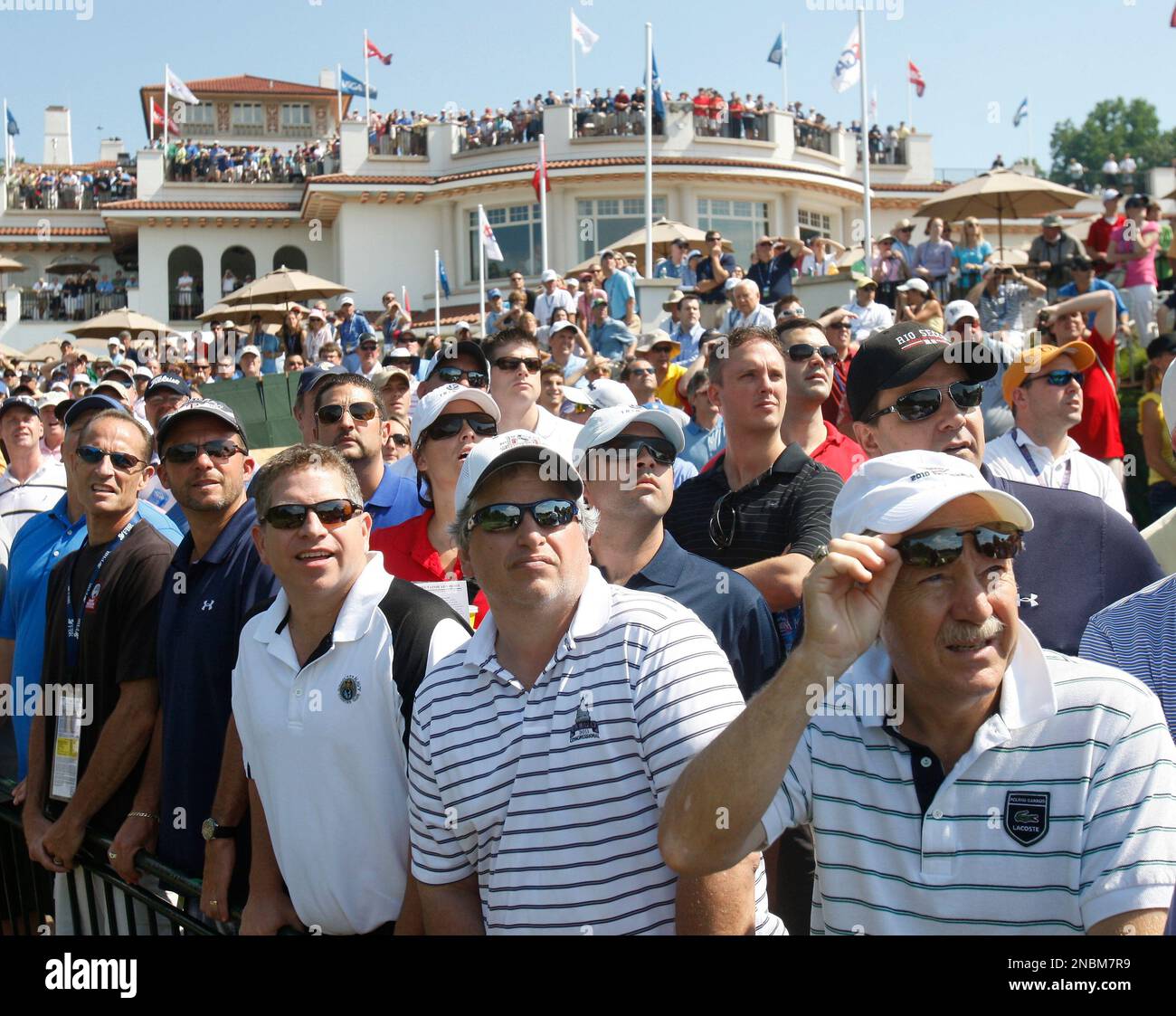 Golf fans near the 18th hole of the Congressional County Club watch ...