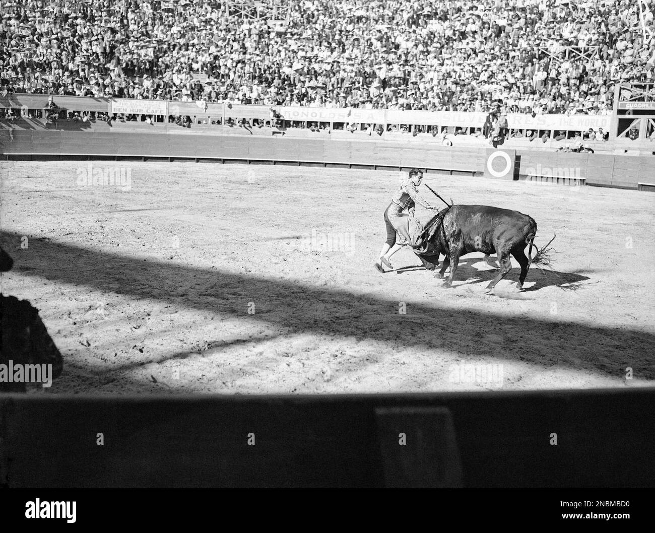 Alberto Balderas, idolized Mexican matador, is shown sinking his sword ...