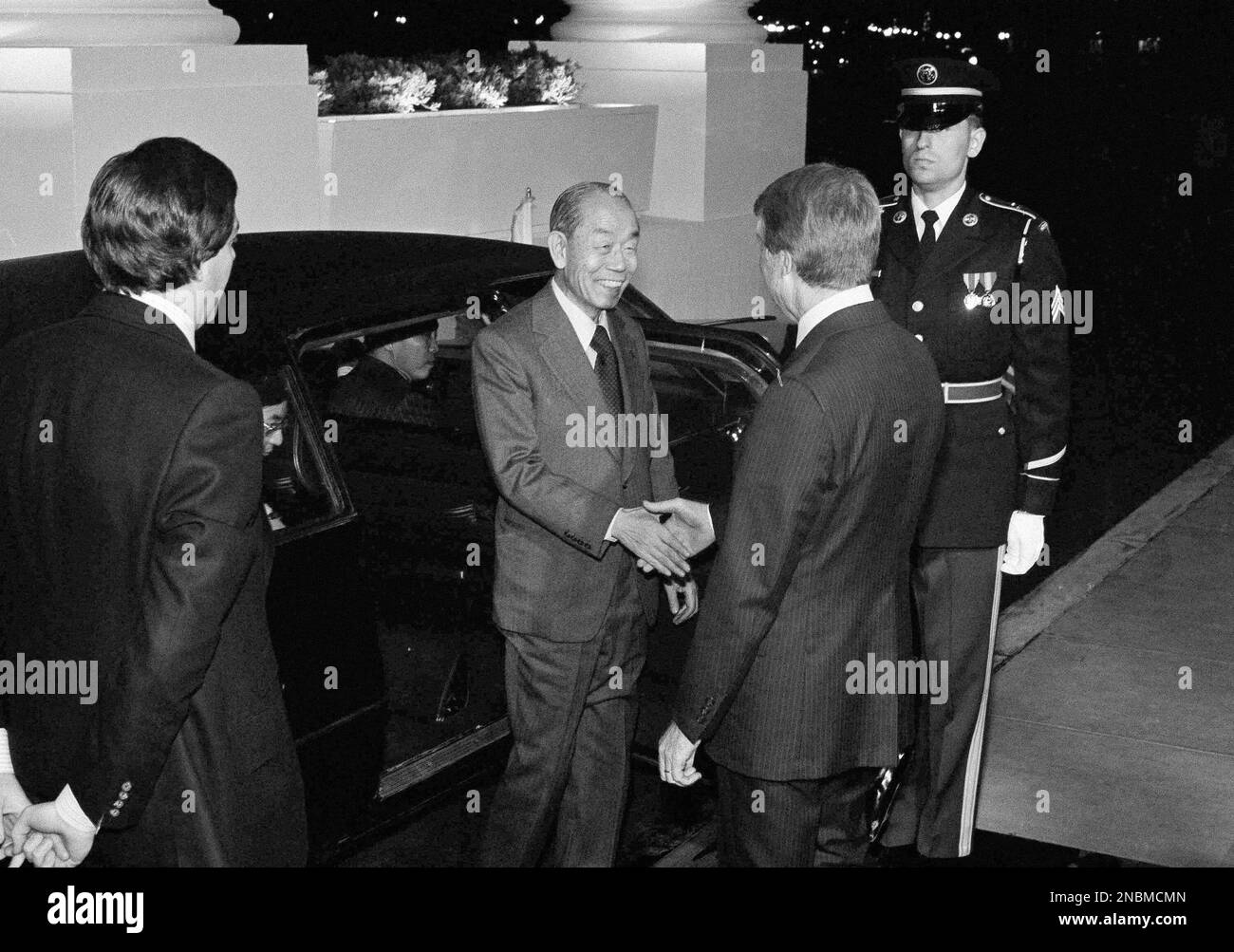 President Jimmy Carter shakes hands with Japanese Prime Minister Takeo ...