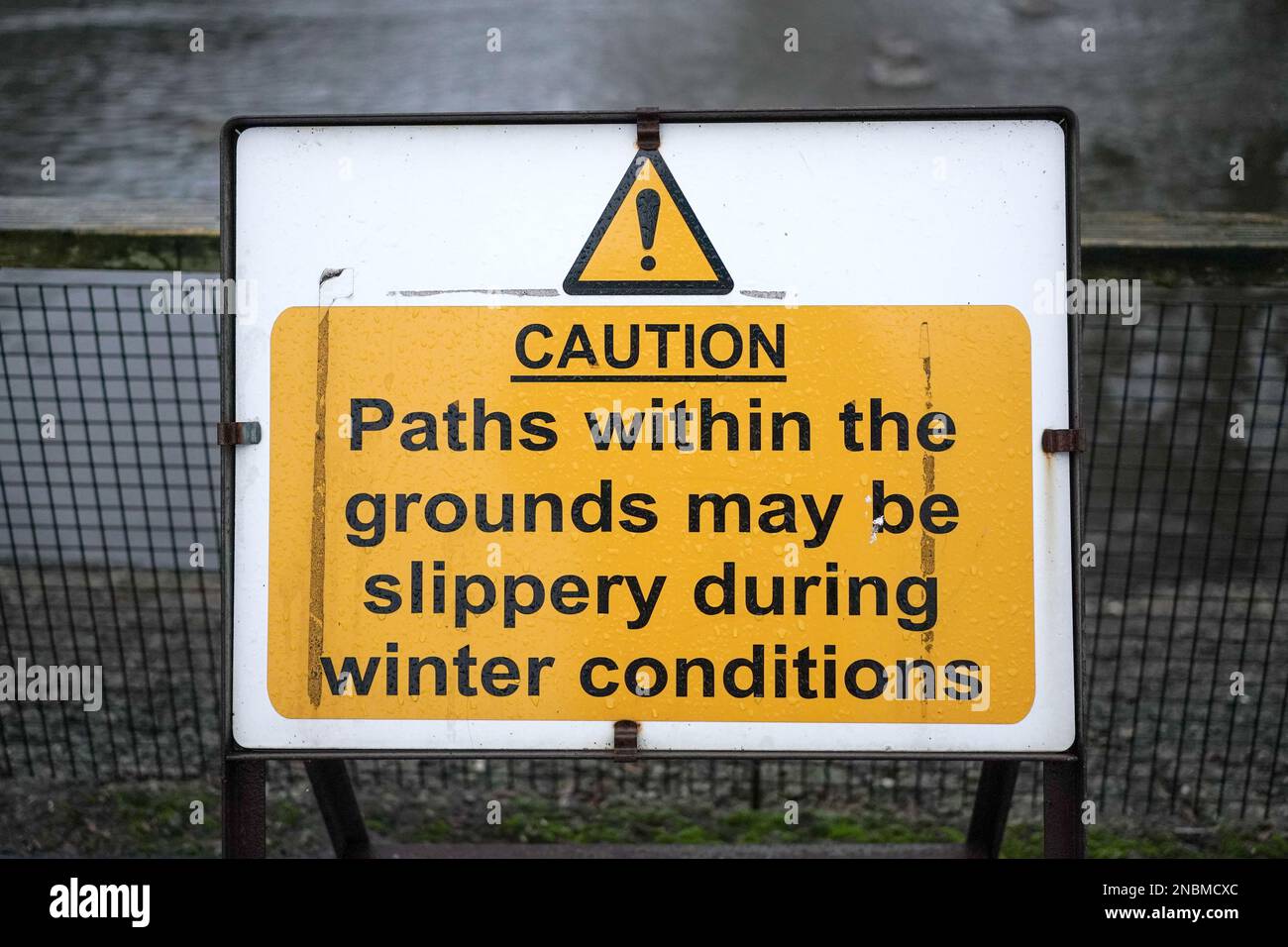 Caution Slippery Grounds Sign Stock Photo - Alamy