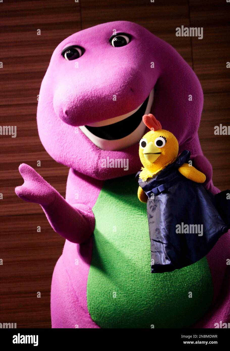 Characters Barney the Dinosaur, left, and Chica the Chicken pose for a ...