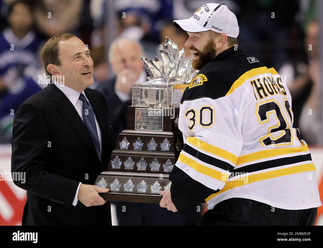 Boston Bruins goalie Tim Thomas (30) is presented the Conn Smythe ...