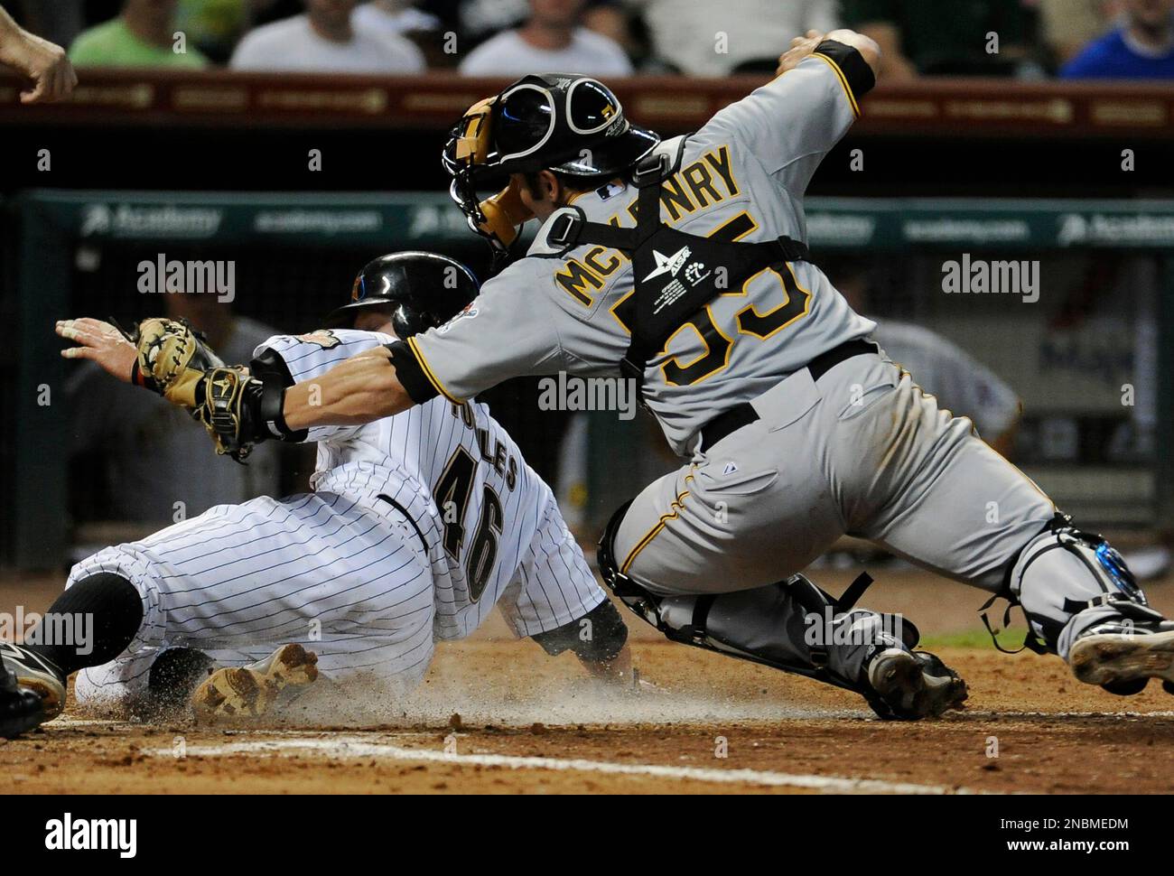 Houston Astros' J.R. Towles (46) slides past Pittsburgh Pirates catcher ...