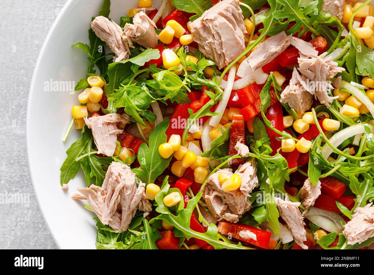 Canned tuna salad with arugula and fresh vegetables, top view Stock ...