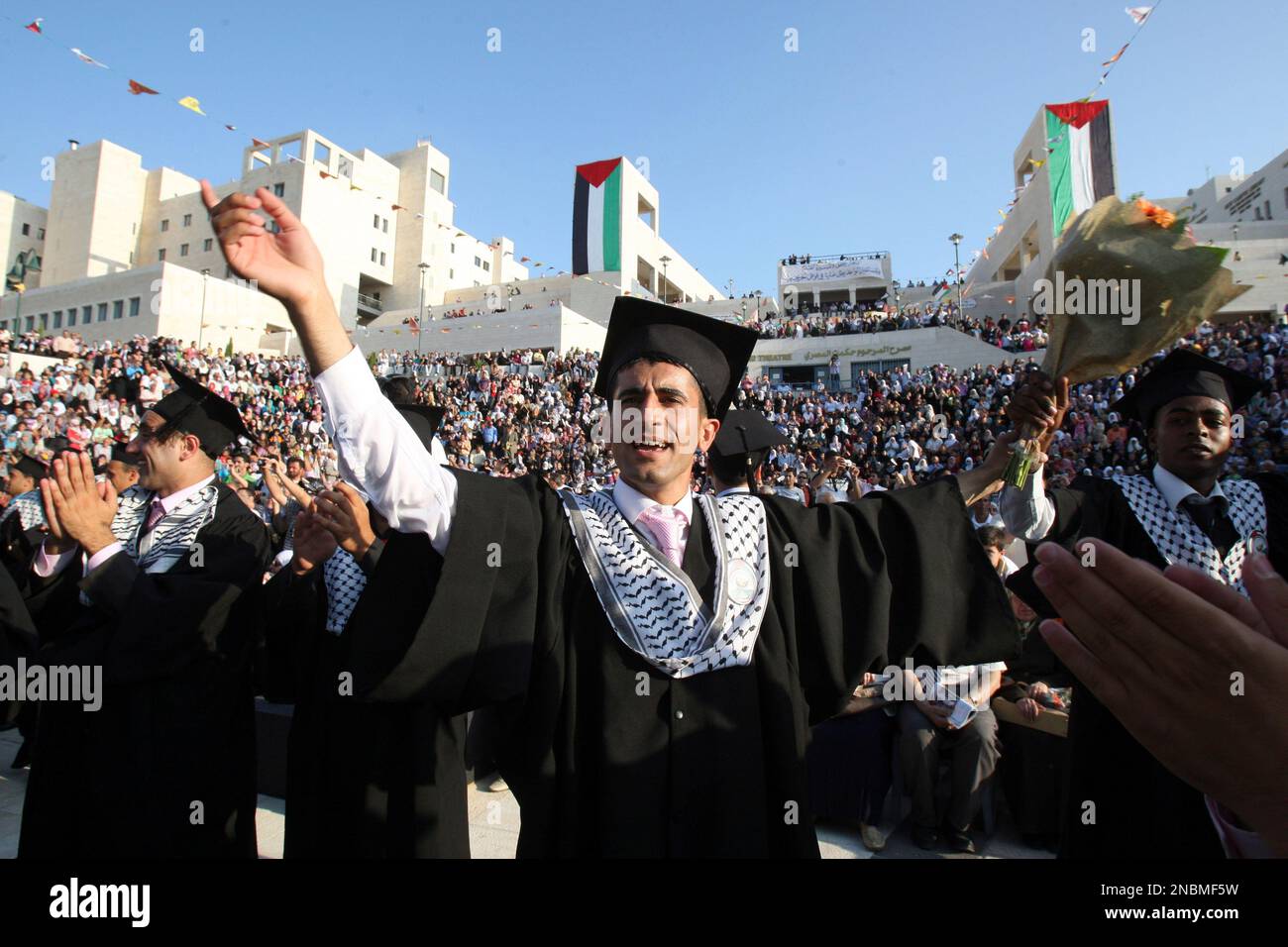 Palestinian students celebrate their graduation at the An Najah ...