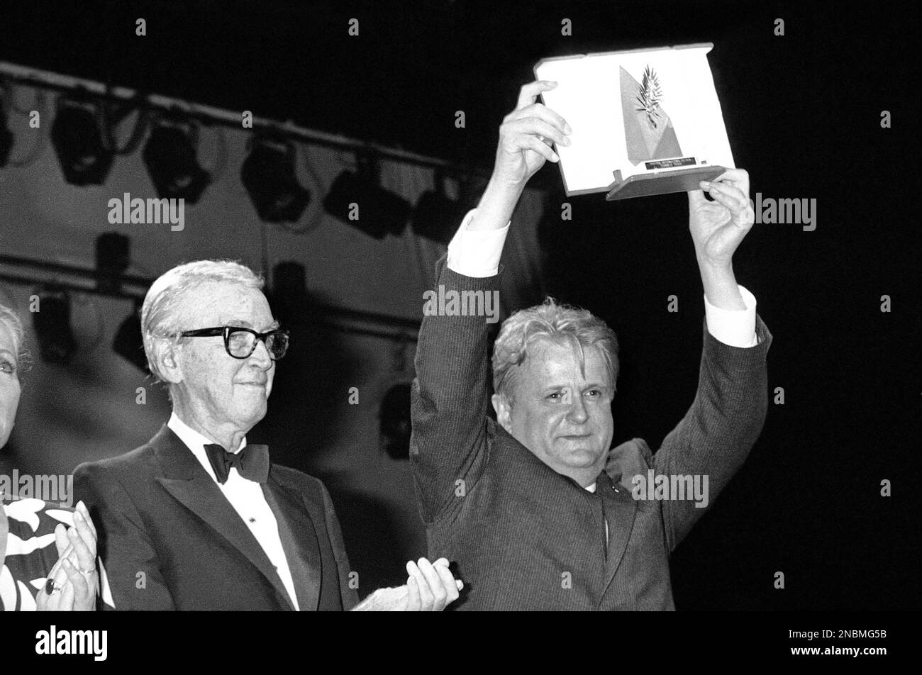 Actor James Stewart, left, applauds as Mirza Pasic of Yugoslavia, the ...