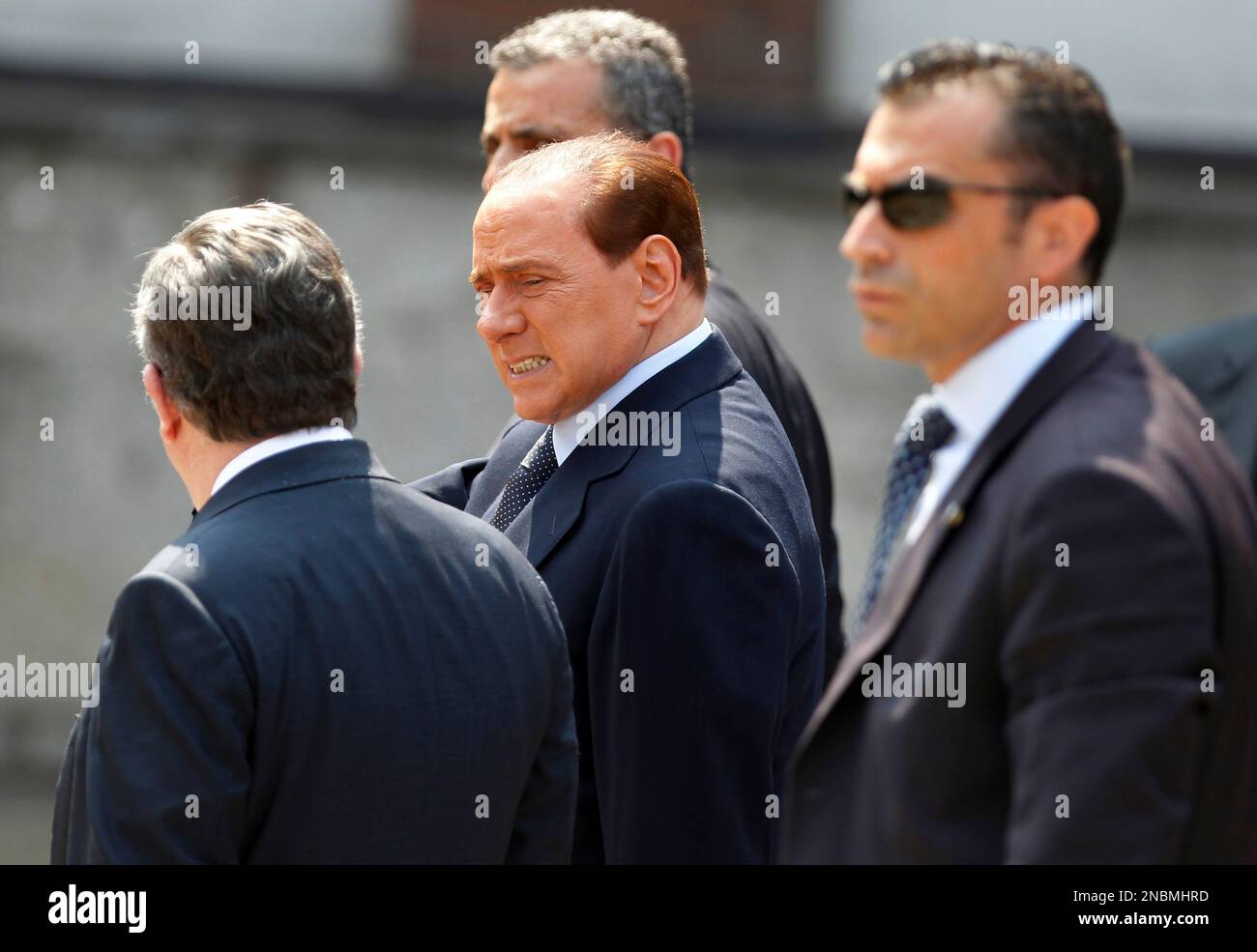 Italian Premier Silvio Berlusconi, center, arrives to the funeral of ...