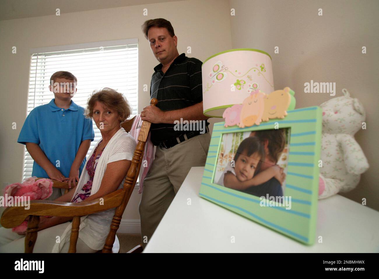 In this photo taken June 6, 2011, Matthew and Beth Long and their son ...