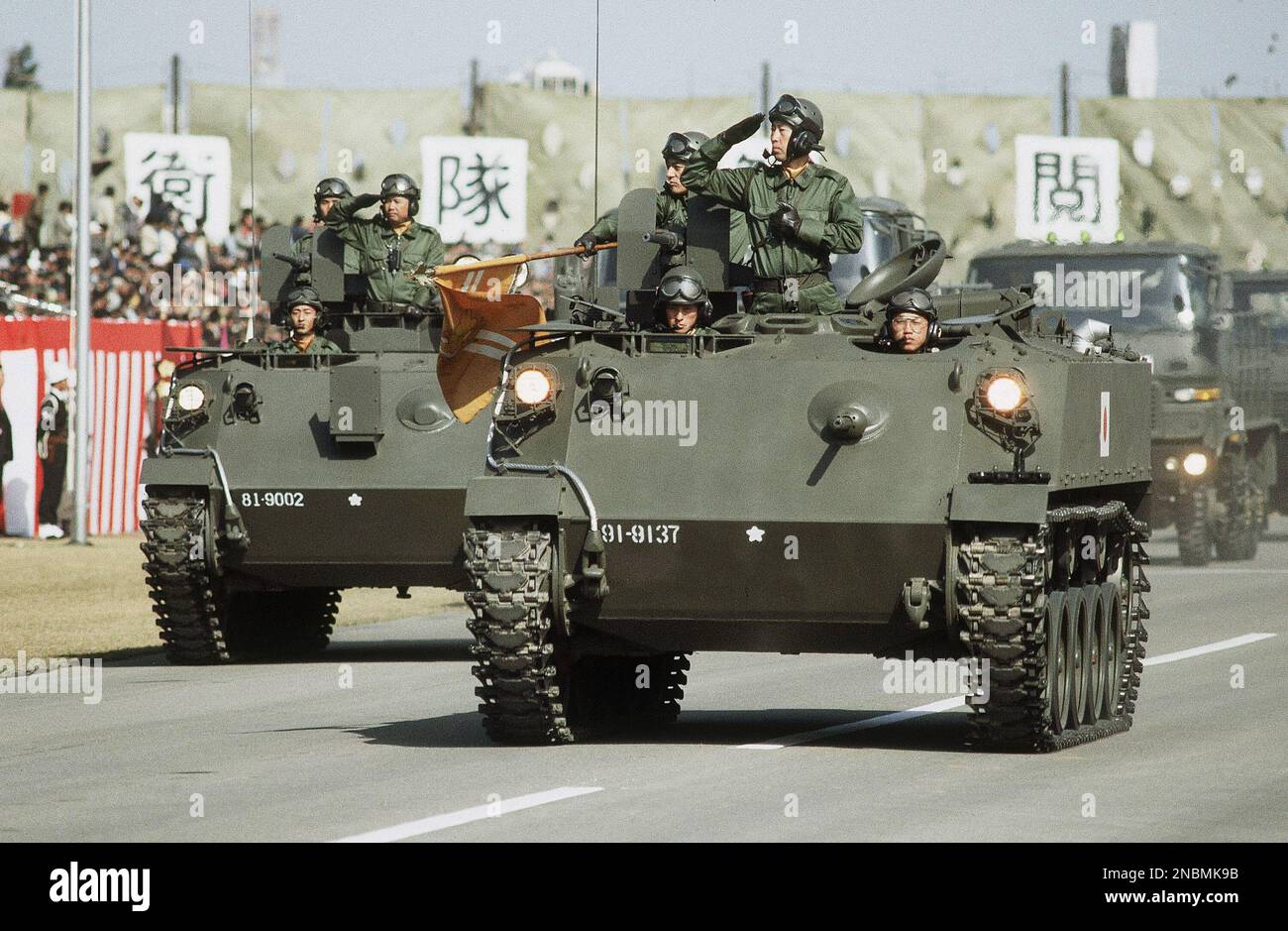 Japan’s ground self-defense forces military parade goes past a ...