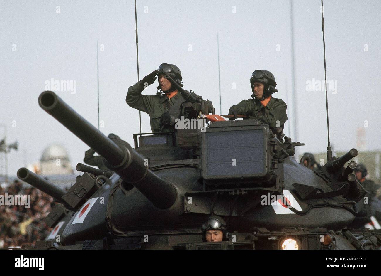 Japan’s ground self-defense forces military parade goes past a ...