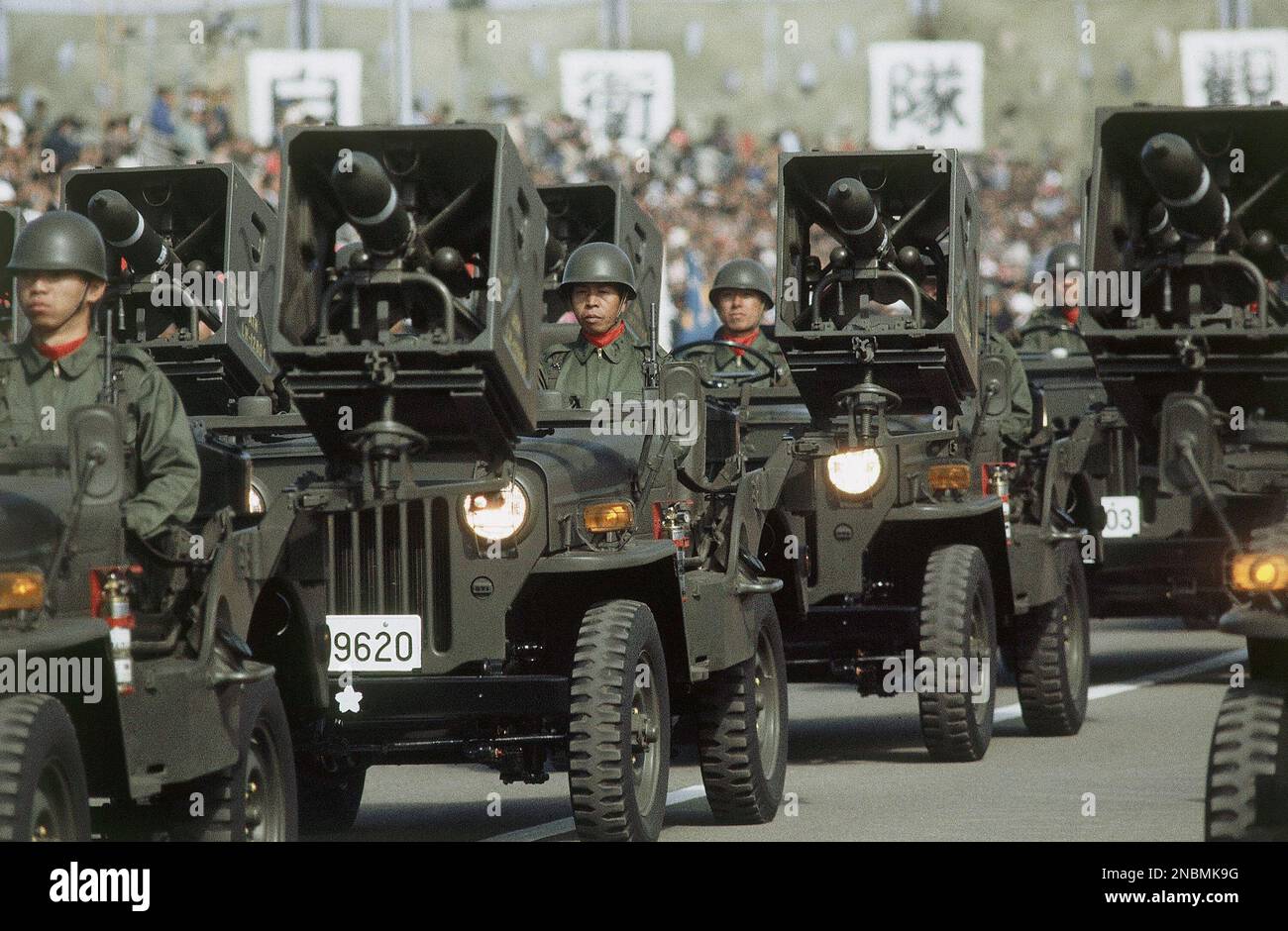 Japan’s ground self-defense forces military parade goes past a ...