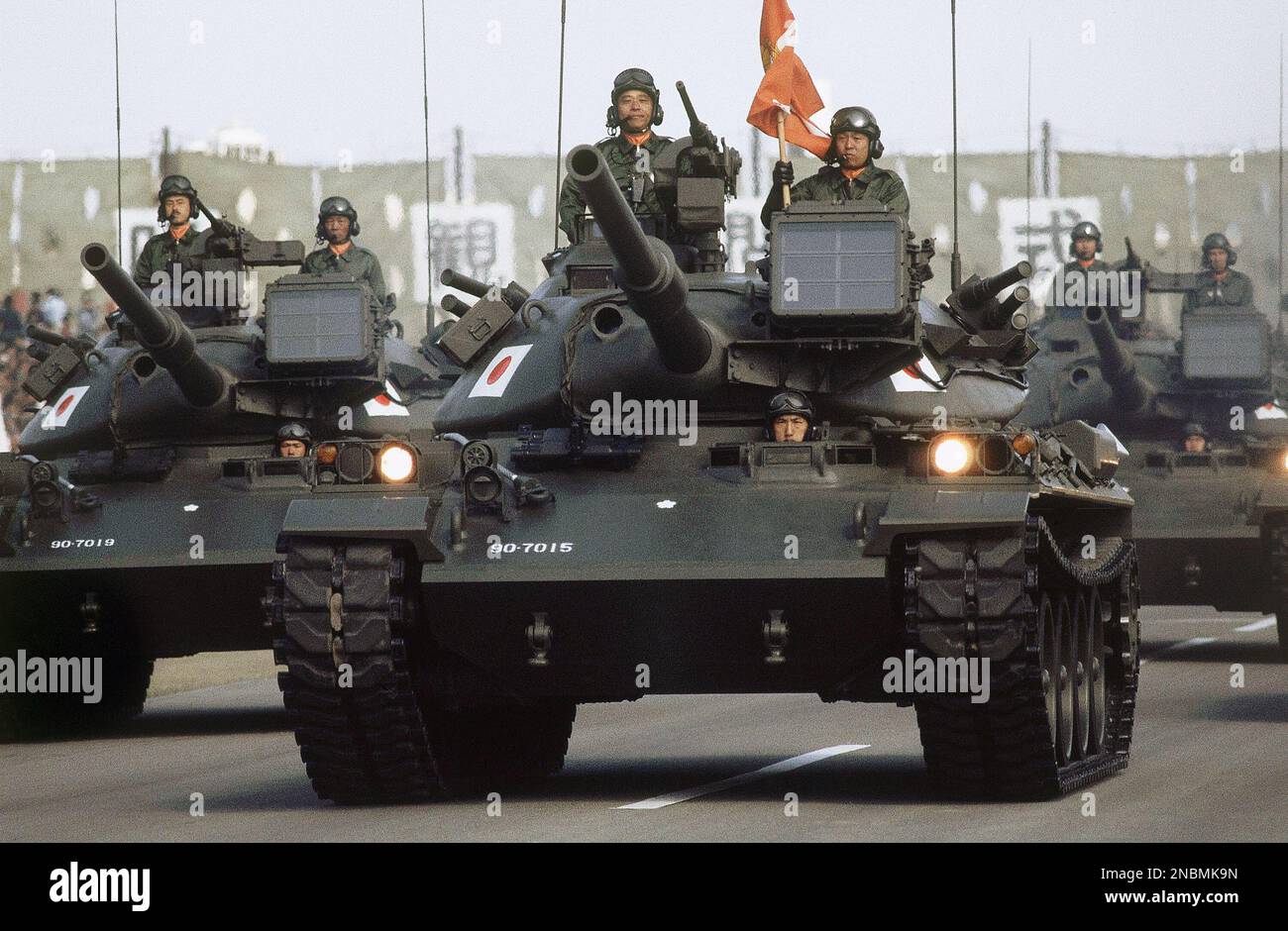 Japan’s ground self-defense forces military parade goes past a ...