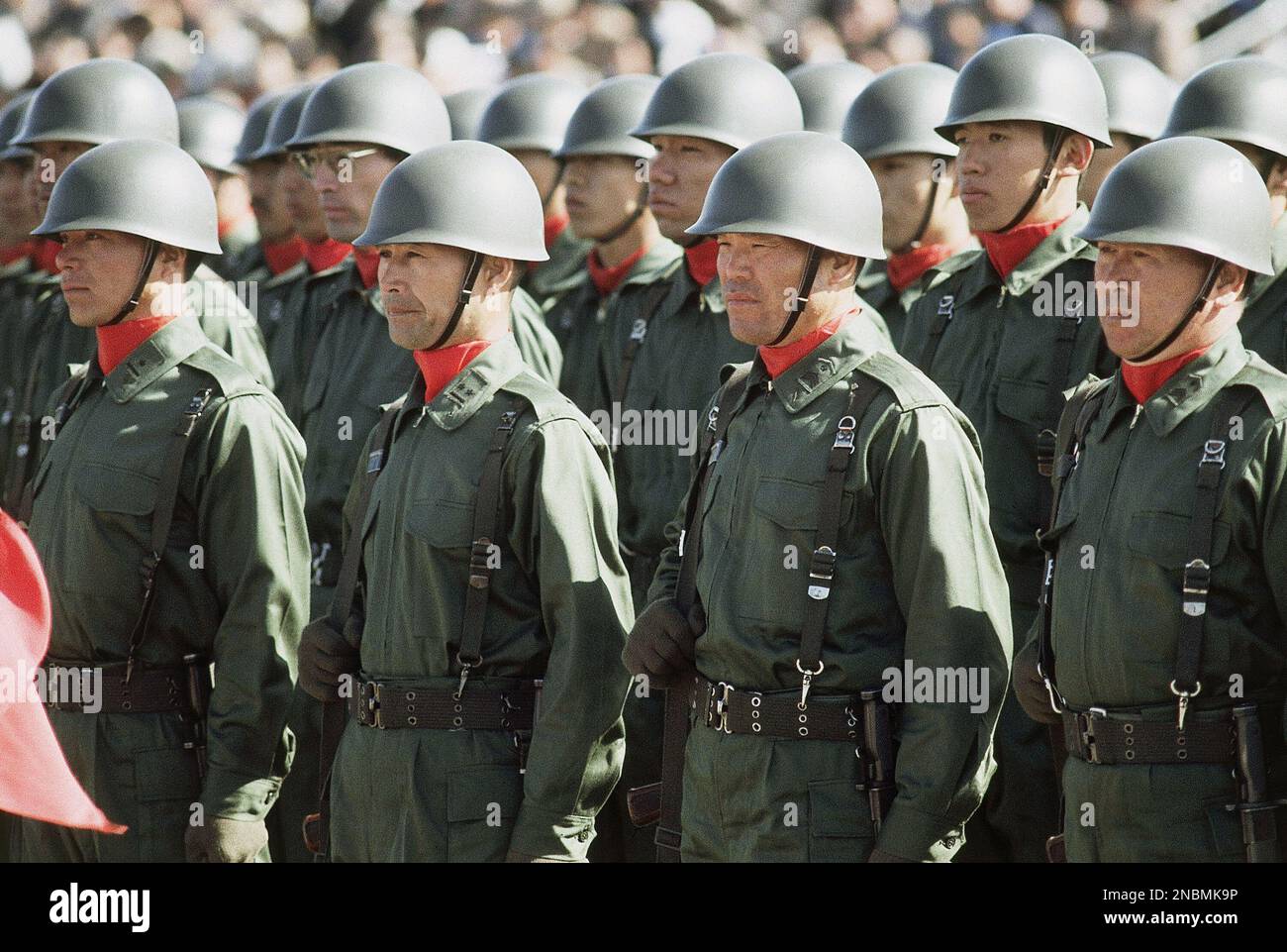 Japan’s ground self-defense forces military parade goes past a ...