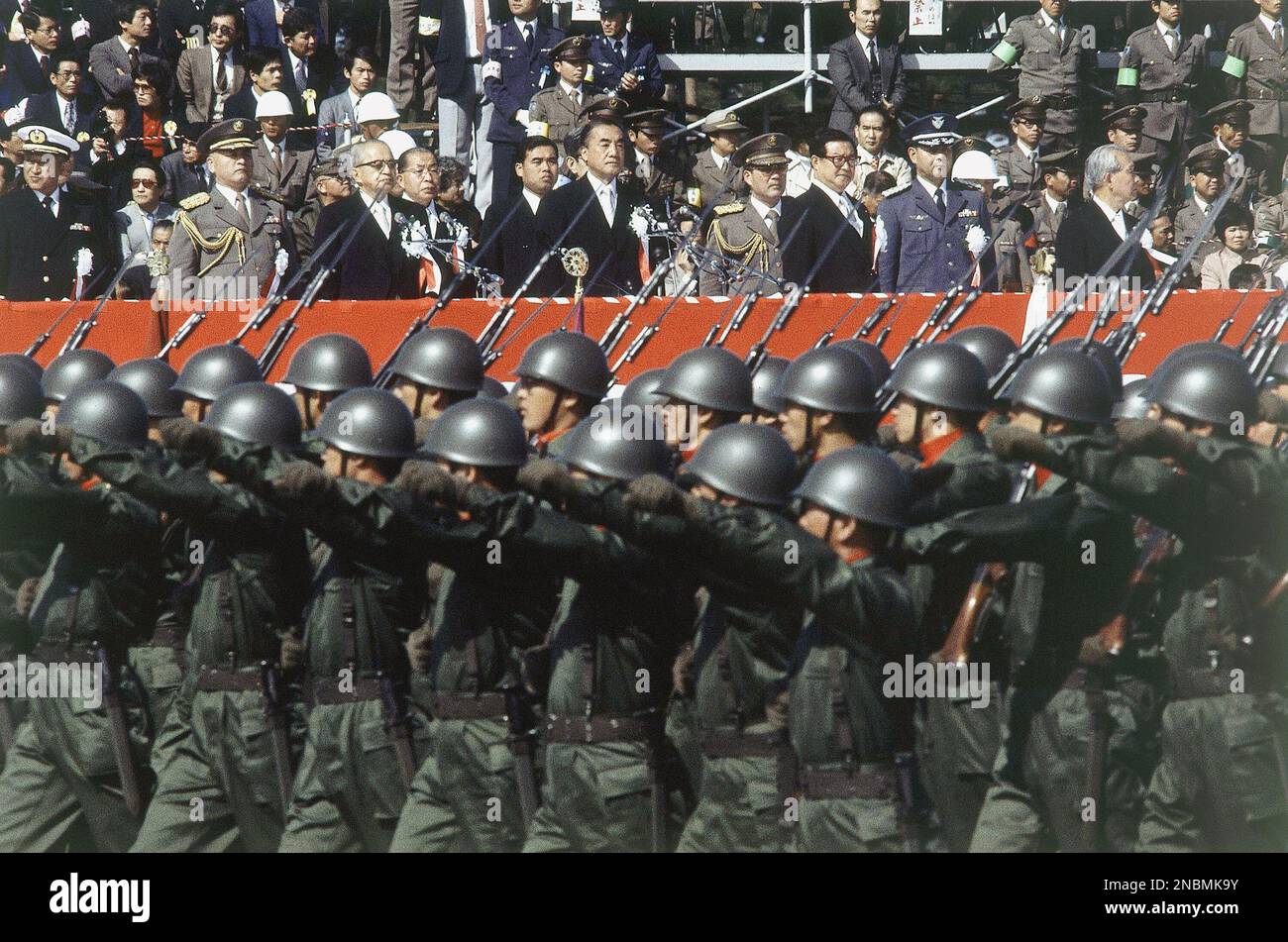 Japan’s ground self-defense forces military parade goes past a ...